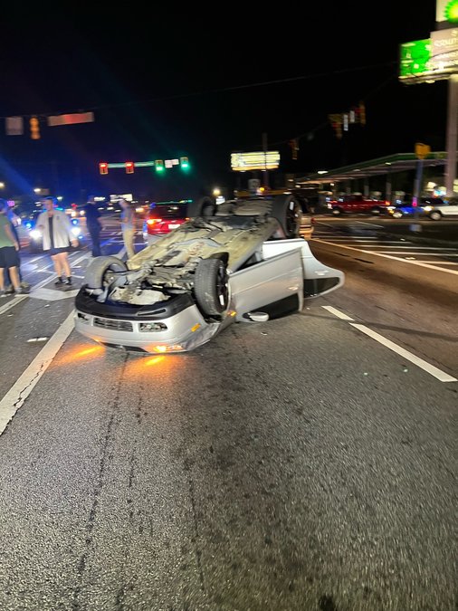 WATCH: Bystanders free driver in overturned car - Forsyth News