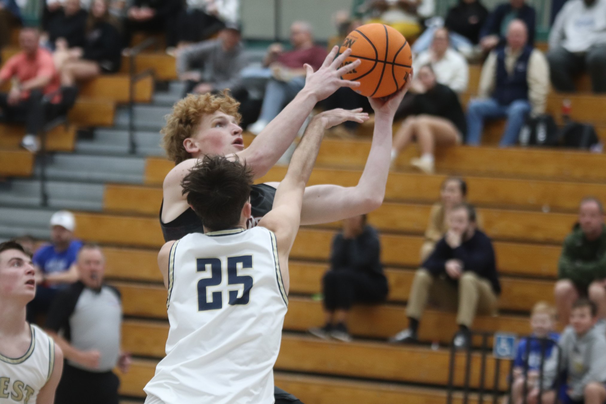 Basketball: Will Dopfer's clutch plays lift Longhorns past Wolverines ...